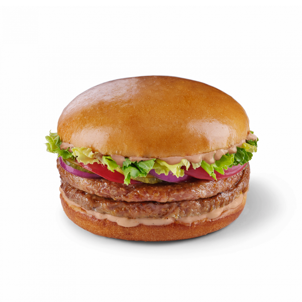 Two juicy cutlets from beef, round pieces of fresh tomato and pickled ...